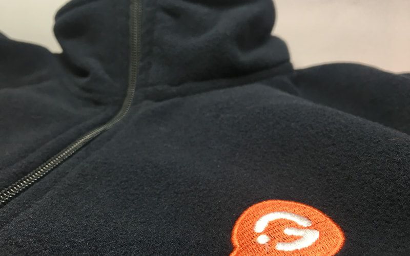 Embroidered fleeces – matching garment to your logo - Garment Printing